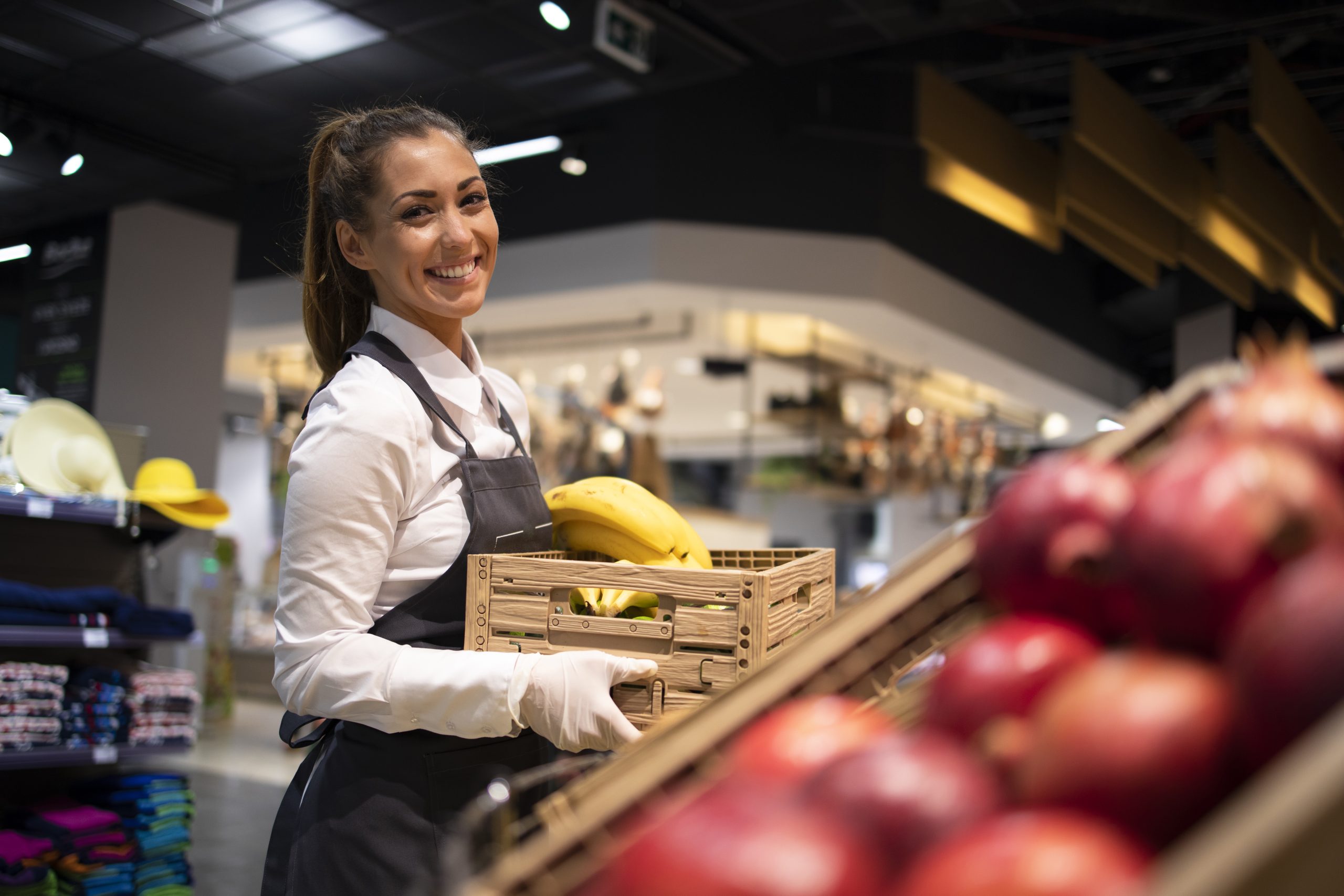 supermarket-worker-supplying-fruit-department-with-food-scaled.jpg